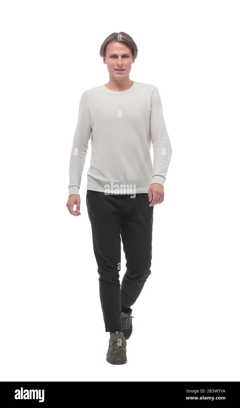 in full growth. confident young man striding forward Stock Photo - Alamy
