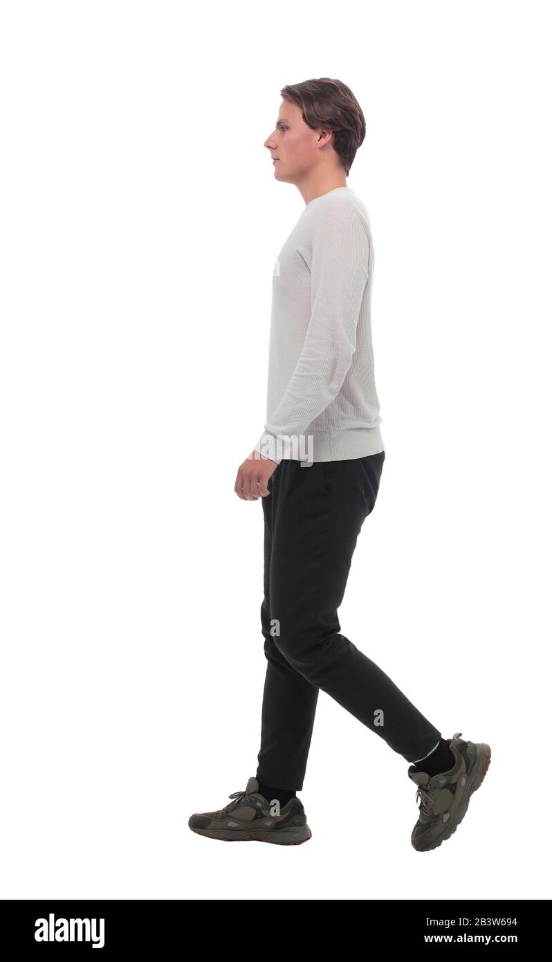 side view . modern young man stepping forward Stock Photo - Alamy