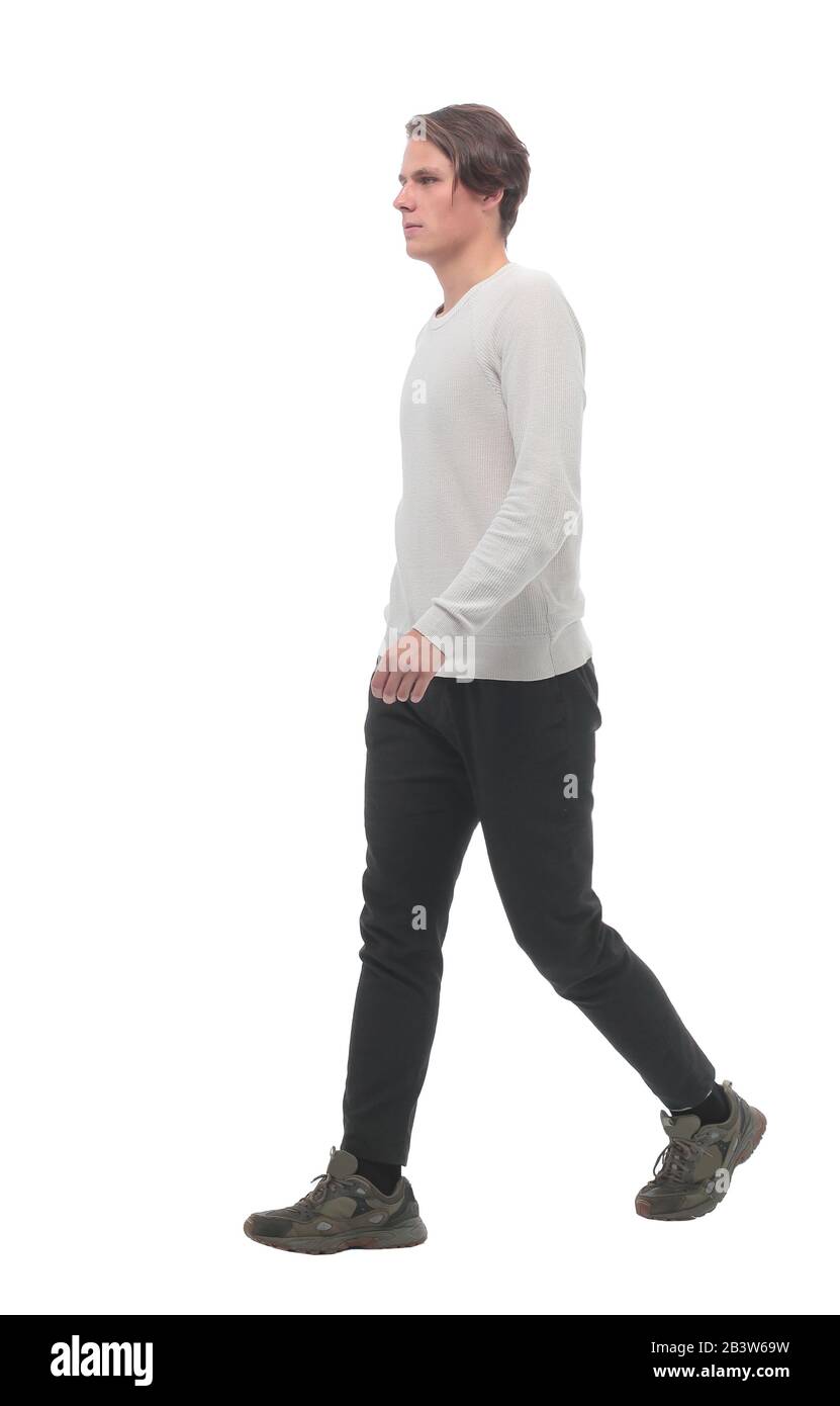 in full growth. confident young man striding forward Stock Photo - Alamy