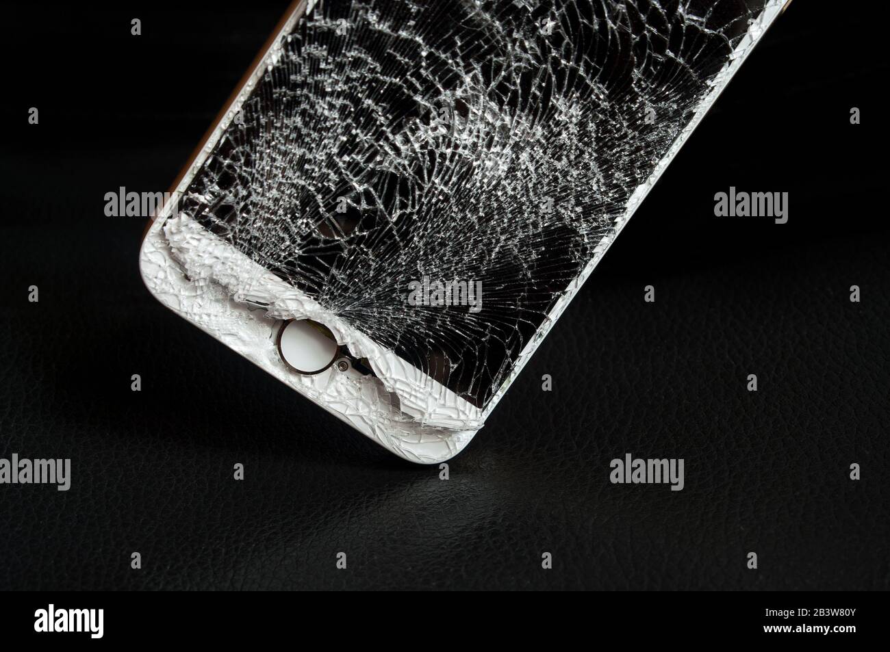 Modern smartphone with highly broken screen on black background Stock ...