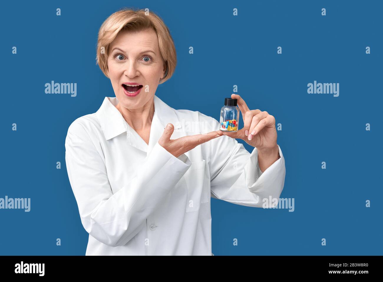 Doctor showing medicine container capsules hi-res stock photography and ...