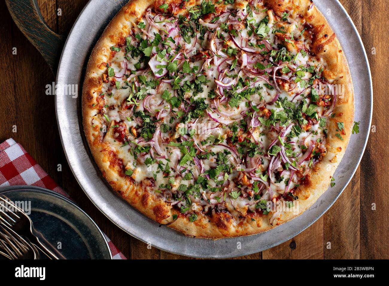 Barbeque chicken pizza with hot sauce and red onion Stock Photo - Alamy