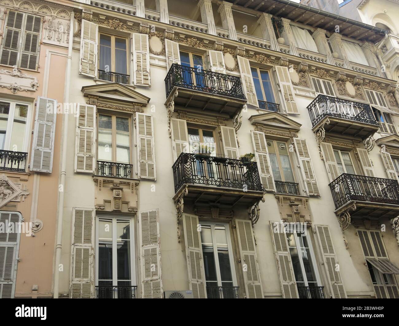 A Mediterranean style of architecture with wooden shutters at all the ...