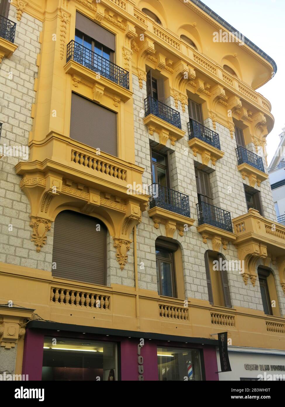 A Mediterranean style of architecture with wooden shutters at all the ...