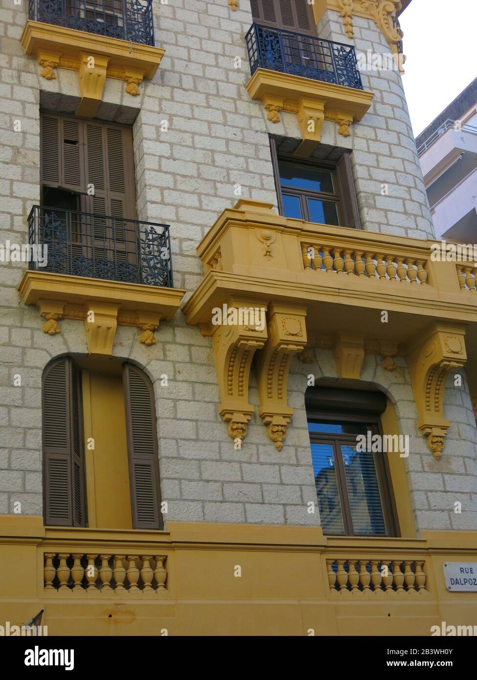 A Mediterranean style of architecture with wooden shutters at all the ...