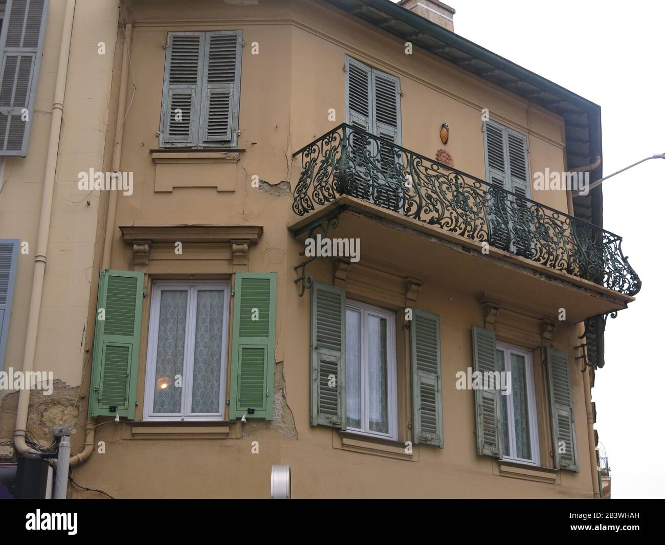 A Mediterranean style of architecture with wooden shutters at all the ...