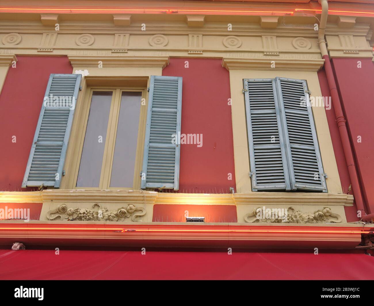 A Mediterranean style of architecture with wooden shutters at all the ...