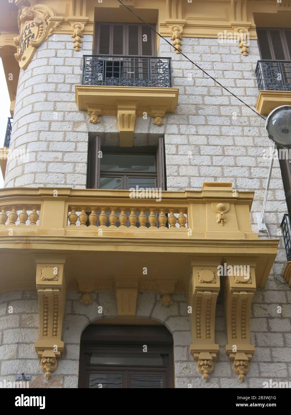 A Mediterranean style of architecture with wooden shutters at all the ...