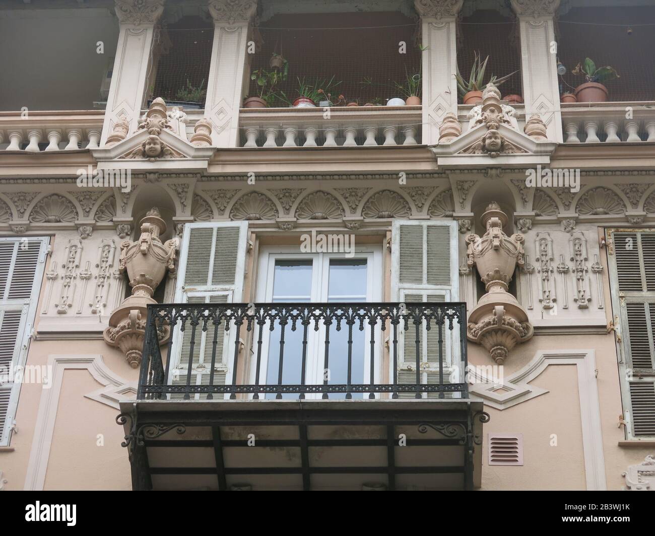 A Mediterranean style of architecture with wooden shutters at all the ...