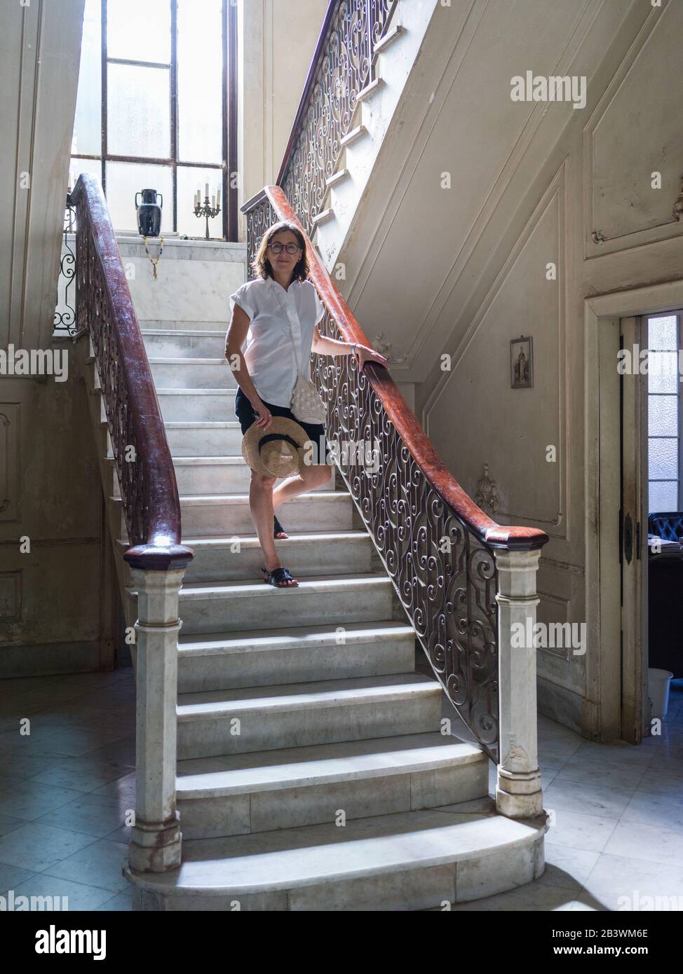 Woman standing on steps hi-res stock photography and images - Alamy