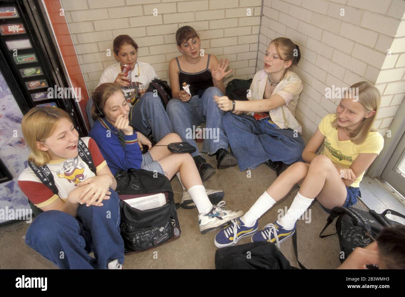 Austin, Texas USA: Junior high school girls sitting on floor and ...