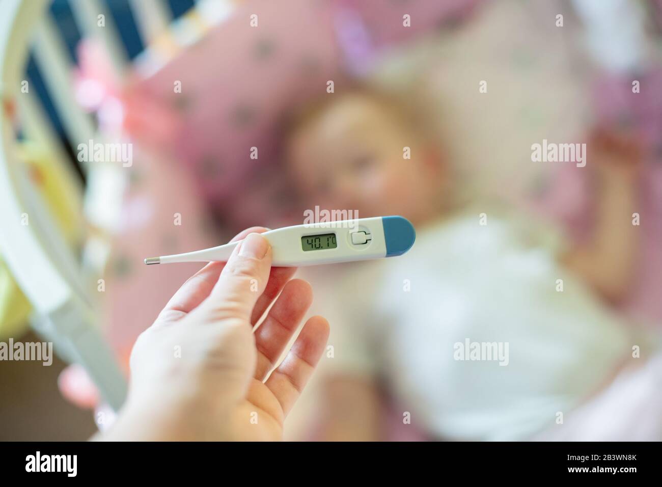 Close-up medical thermometer, Parent measuring temperature of ill kid ...