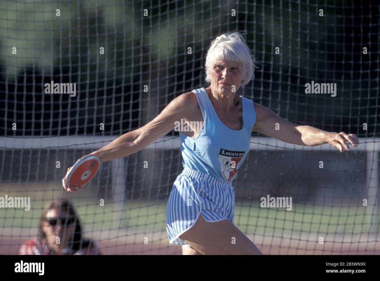 Elderly woman throwing discus hi-res stock photography and images - Alamy