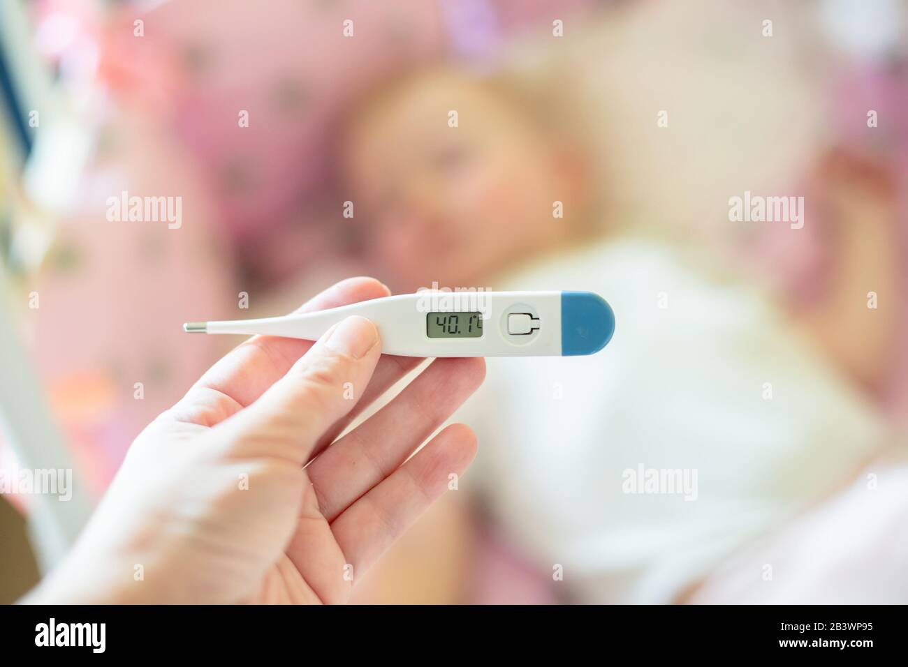Close-up medical thermometer, Parent measuring temperature of ill kid ...