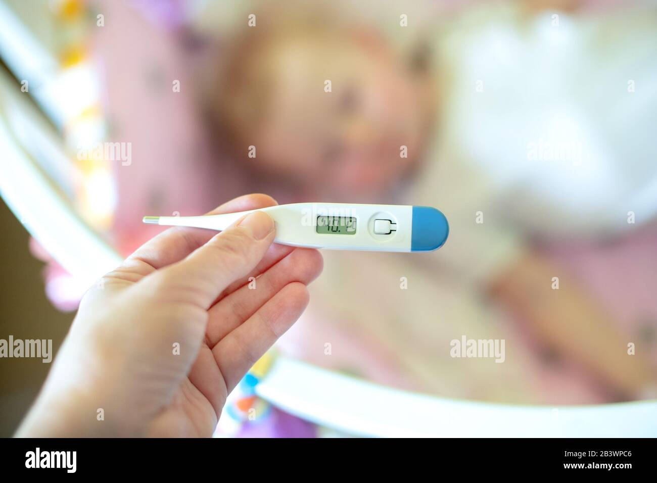 Close-up medical thermometer, Parent measuring temperature of ill kid ...