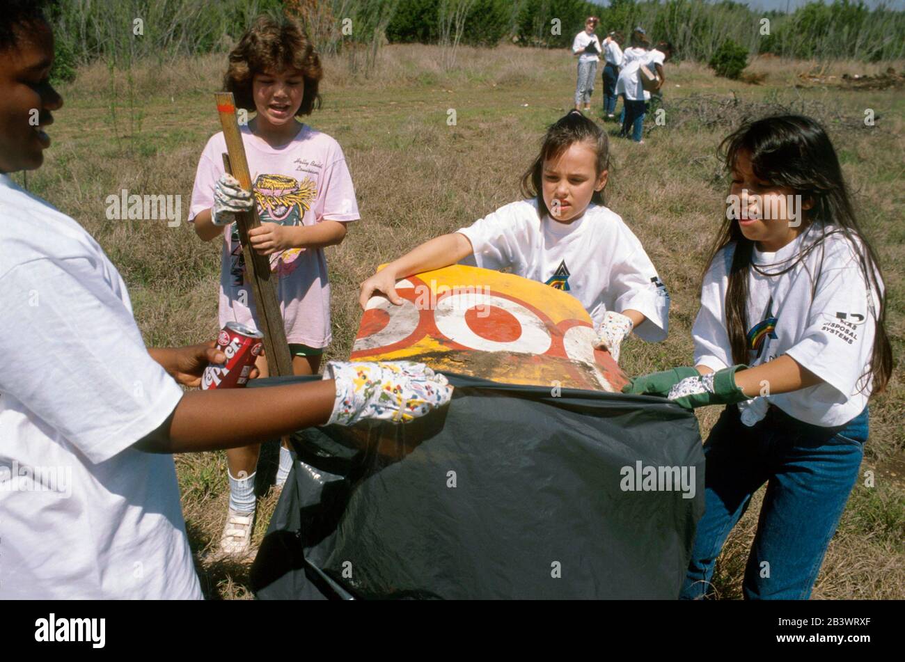 Austin, Texas USA: Children working together to clean up trash from ...