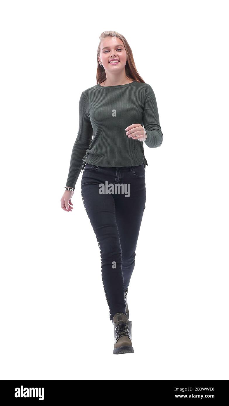 in full growth. smiling girl student striding forward Stock Photo - Alamy