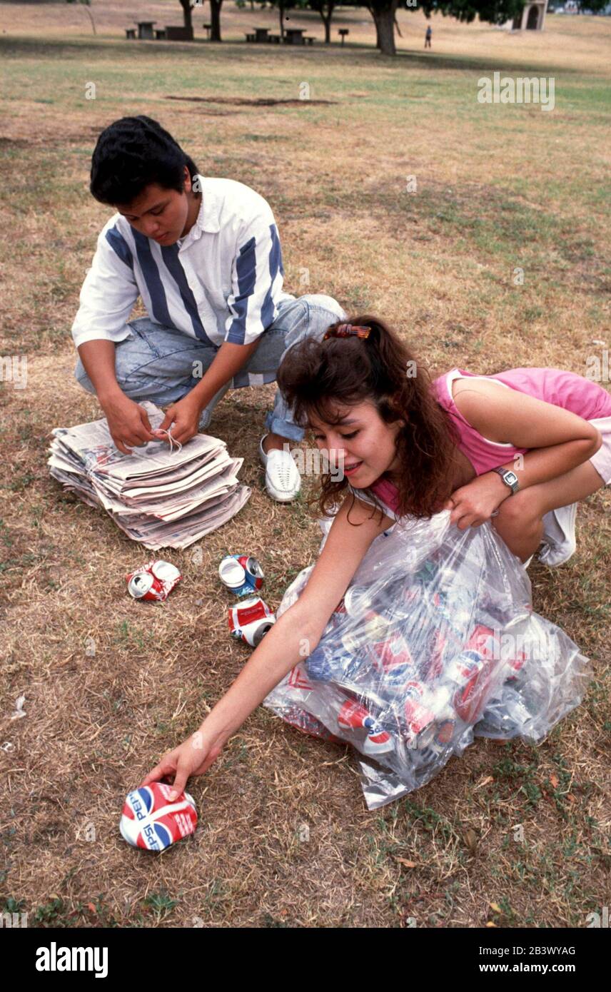 Austin Texas USA, circa 1989: Hispanic teen girl and boy collect ...