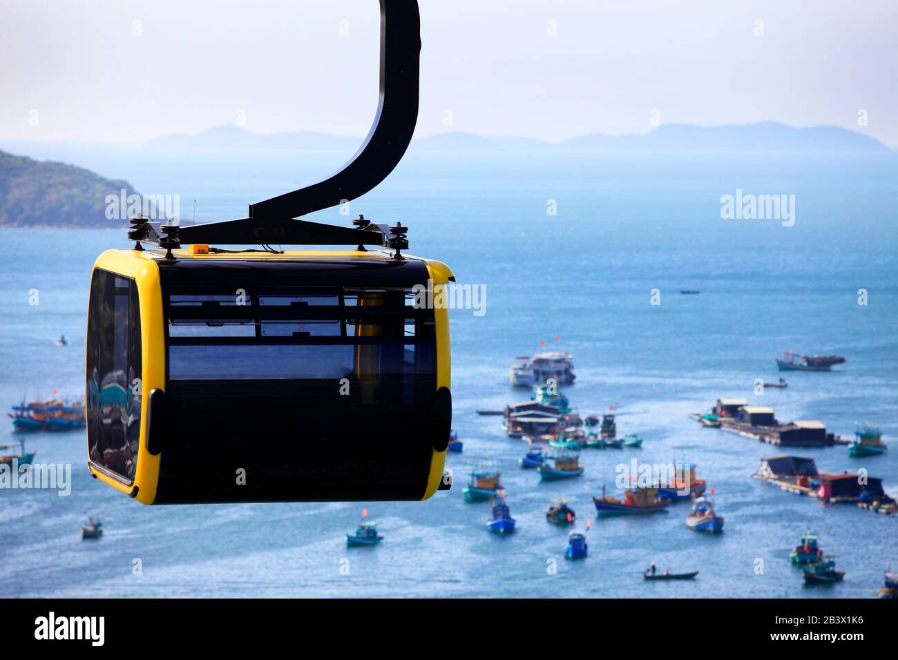 Cable car cabin over the ocean with fishing boats. Phu Quoc Stock Photo ...