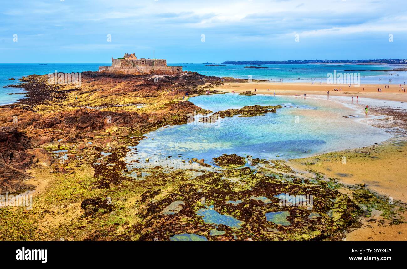 Sand beach and tidal lagoon around the Fort National on Atlantic ocean ...