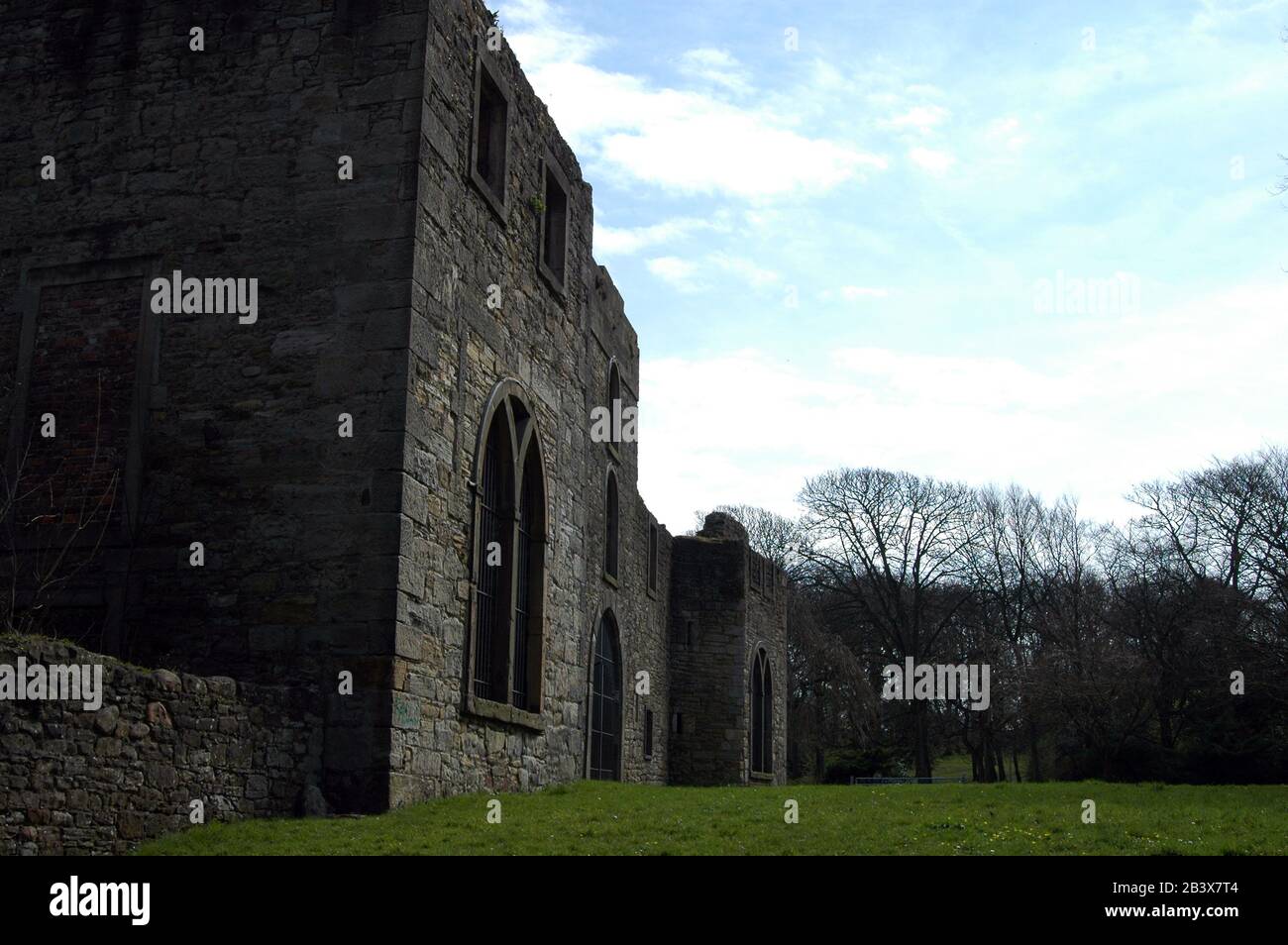 Curwen Hall, Workington Hall castle ruins in shade on a spring day ...