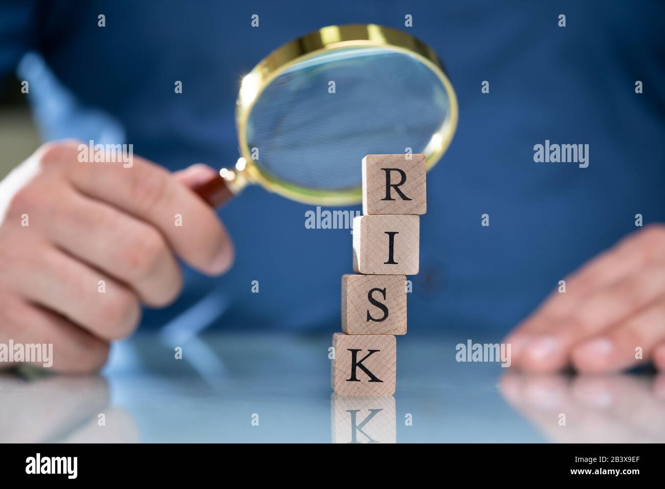 Inspecting Risk Blocks With Loupe Over Black Background Stock Photo - Alamy