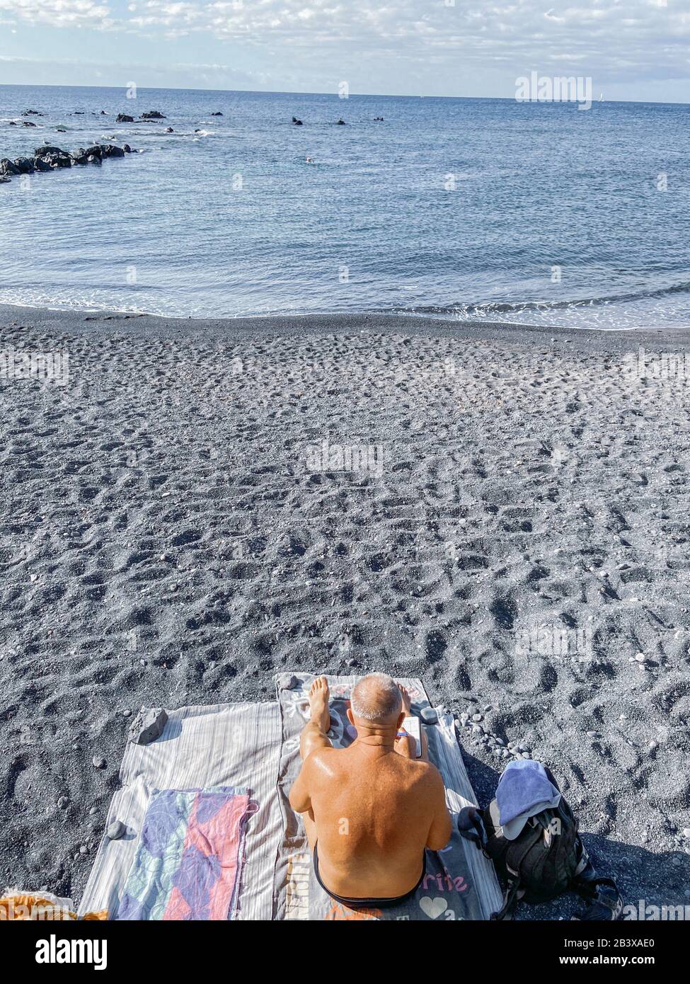 Elderly man sunbathing hi-res stock photography and images - Alamy