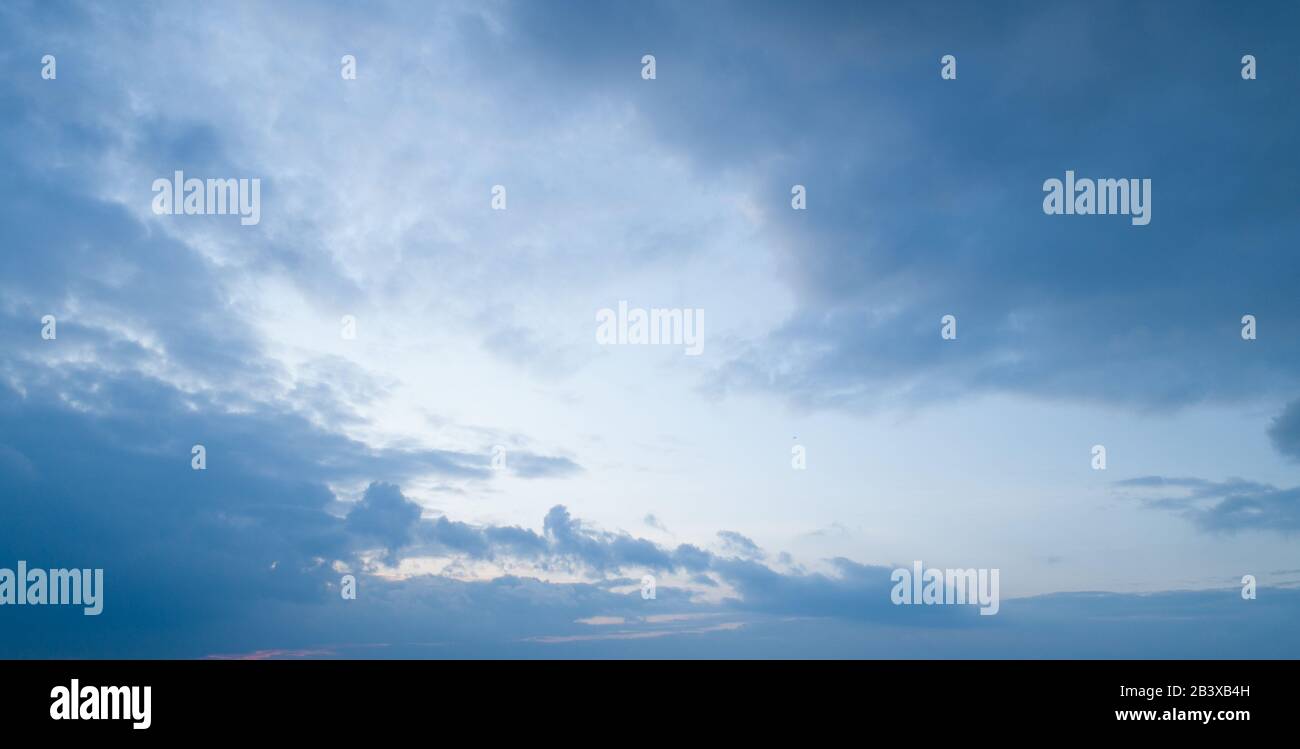 Beautiful sky with stretched clouds during twilight Stock Photo - Alamy