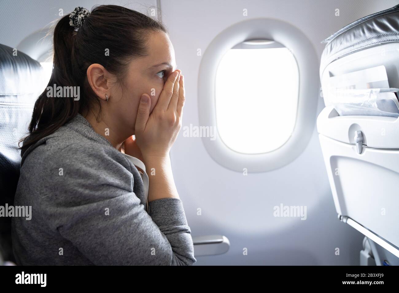 Woman scared plane hi-res stock photography and images - Alamy
