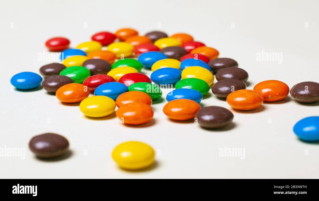 small candy multicolored sweets close up Stock Photo - Alamy