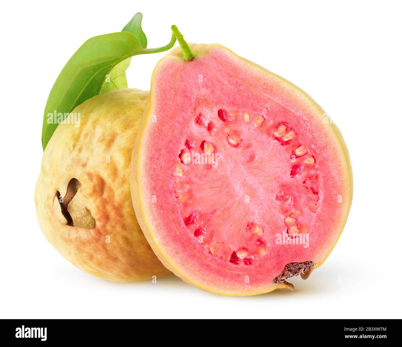 Isolated guavas. Cut guava tropical fruits with yellow skin and pink ...