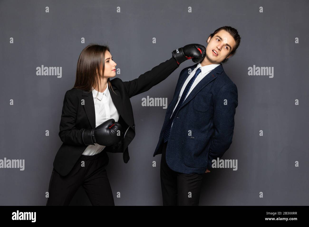 Portrait businessman and business woman with bruises on her arm battle ...