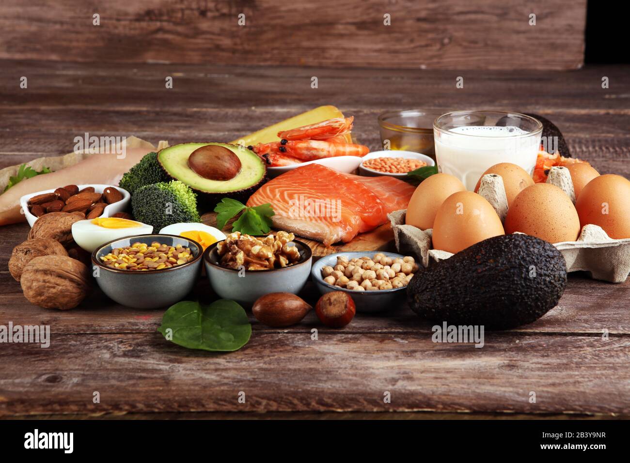 healthy eating and diet concept - natural rich in protein food on table ...