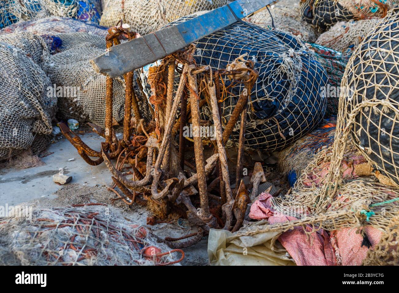 Image of fishing nets and old rusty anchors in Essaouira,Morocco Stock ...