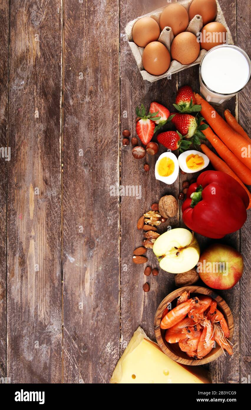 Allergy food concept. Allergy food as almonds, milk, cheese, strawberry ...