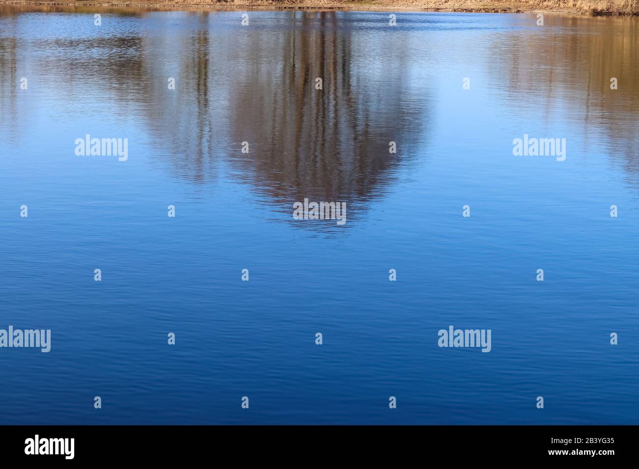 Beautiful smooth water surface texture with small waves and sunlight ...