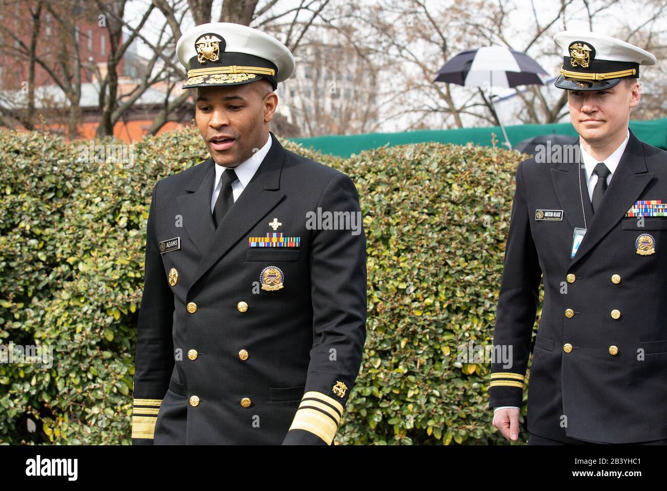 United States Surgeon General Jerome M. Adams, left, walks away after ...