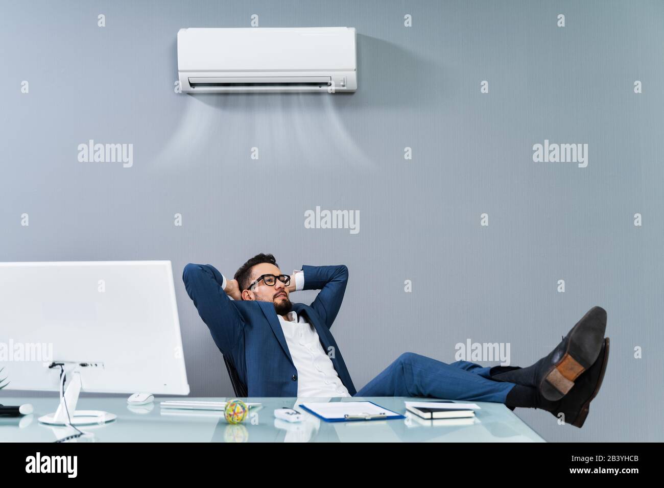 Relaxed Businessman Enjoying The Cooling Of Air Conditioner In The ...