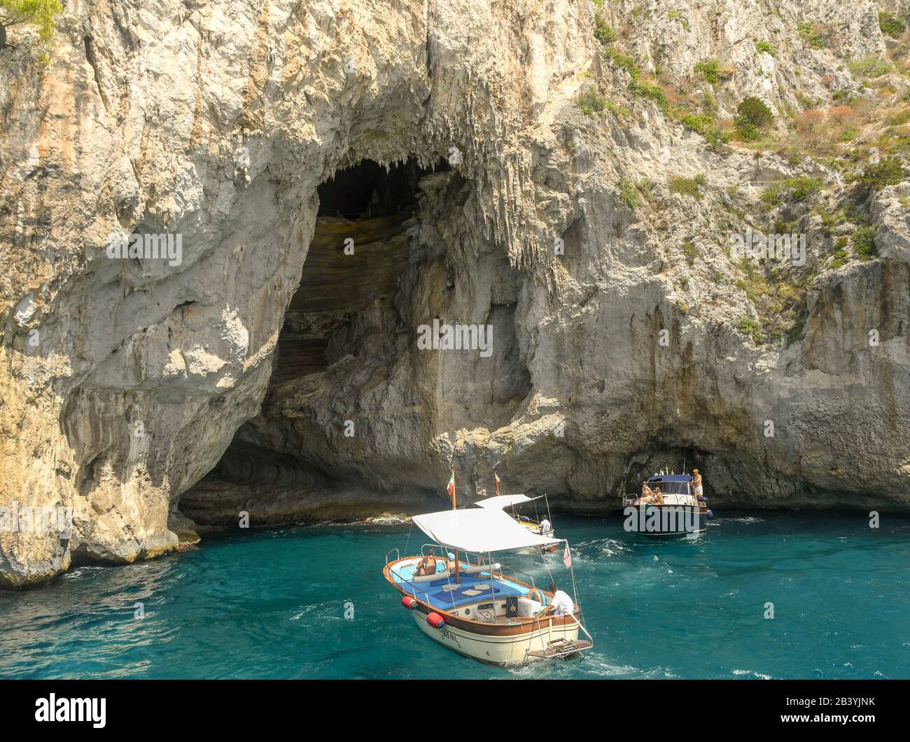 ISLE OF CAPRI, ITALY - AUGUST 2019: Small boats at the entrance to the ...
