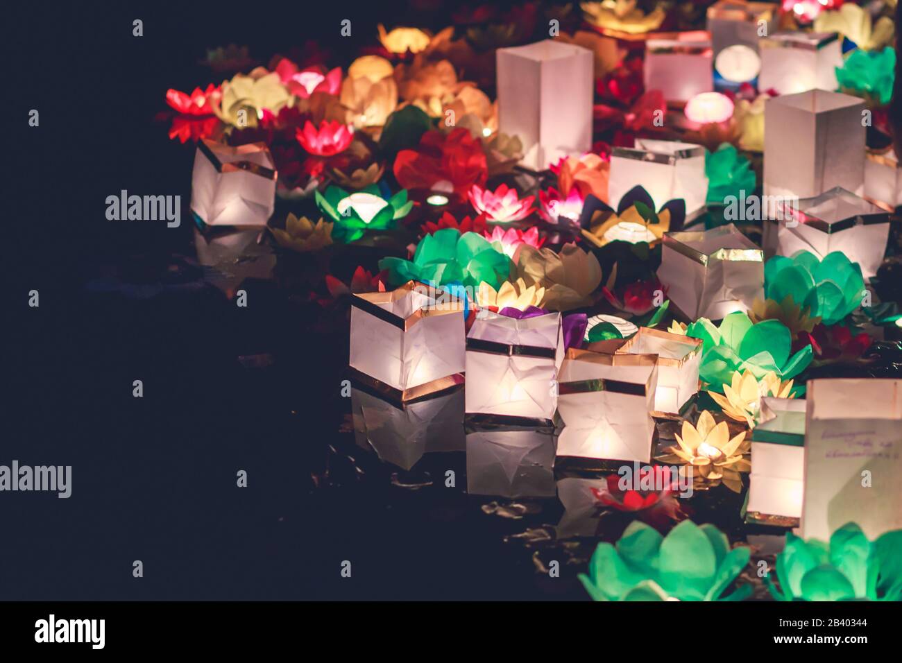 Beautiful Multicolored floating lanterns in the water in Chinese or ...