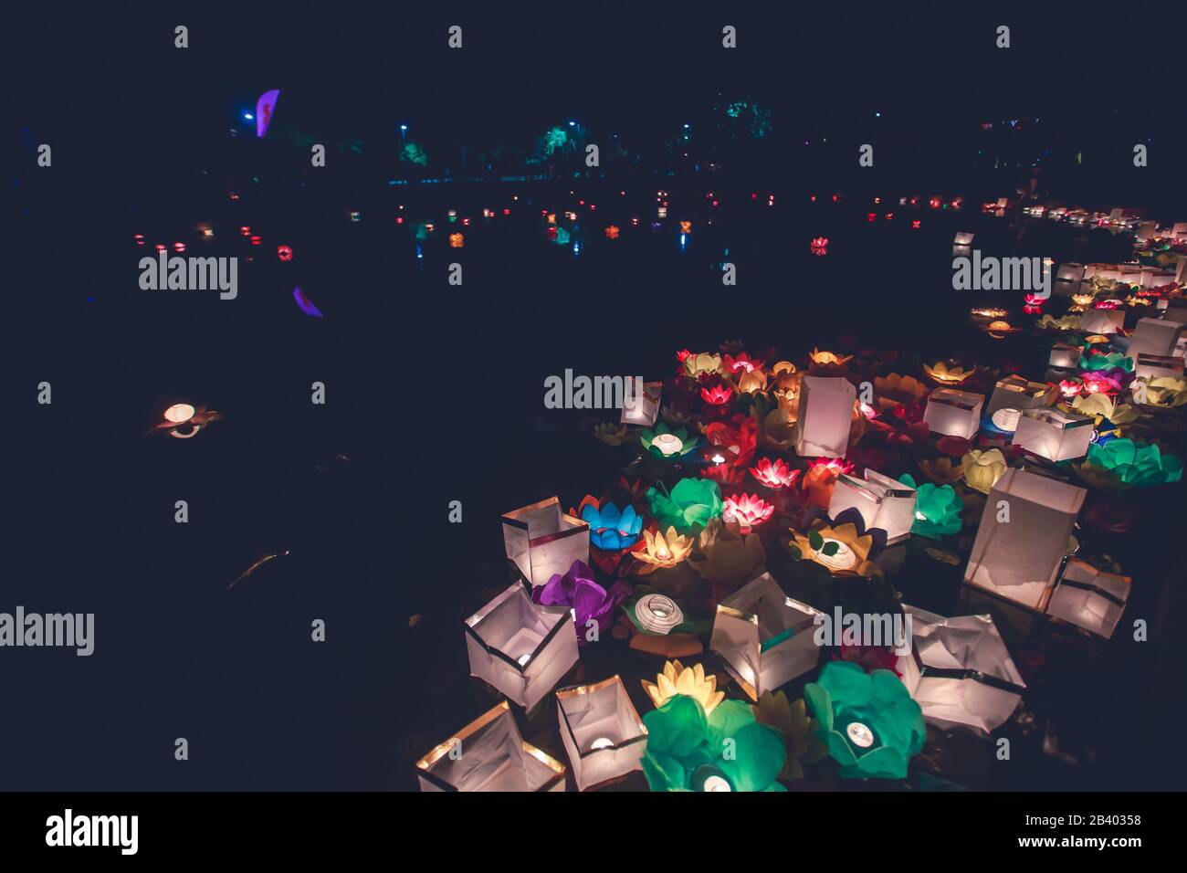 Beautiful Multicolored floating lanterns in the water in Chinese or ...