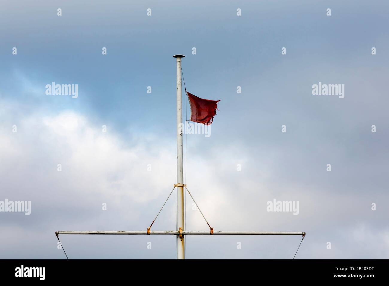 Nautical red flag flying Stock Photo - Alamy