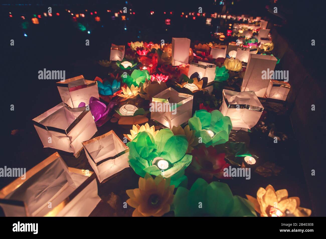 Beautiful Multicolored floating lanterns in the water in Chinese or ...