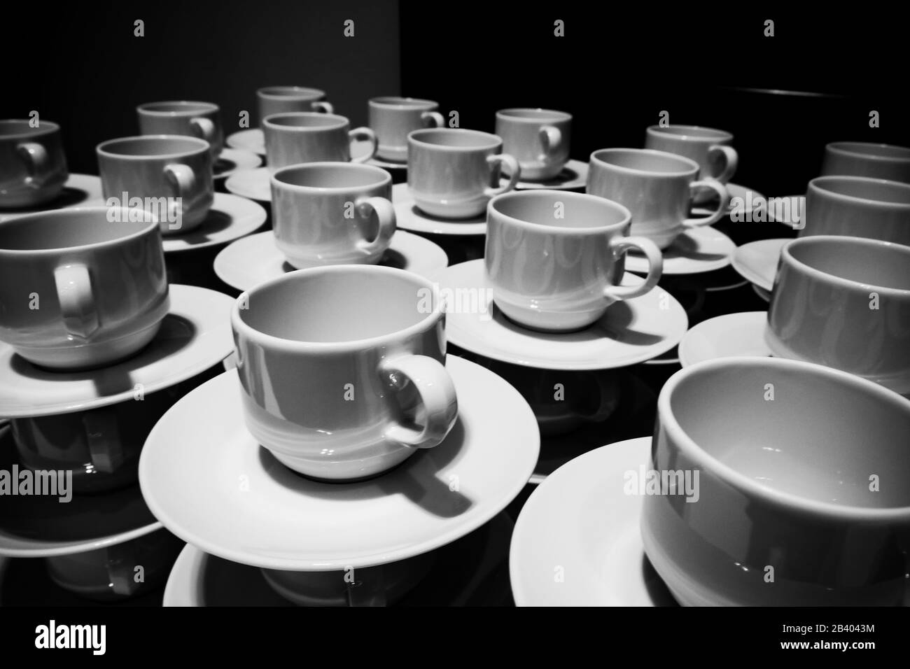 Stacked coffee cups at a meeting Stock Photo - Alamy