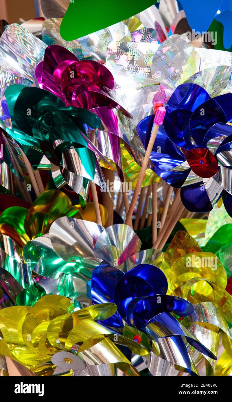 The photo shows different colourful wind turbines Stock Photo - Alamy