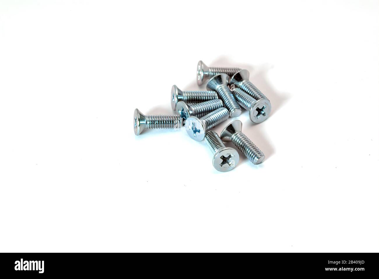 Steel bolts close-up white background isolate Stock Photo - Alamy