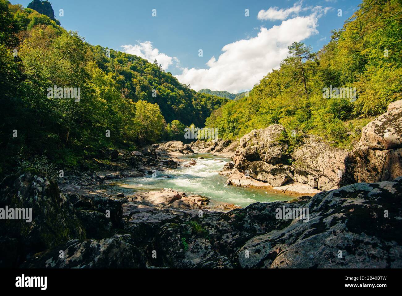 The mountain river flows through the gorge. Turquoise water. Belaya ...