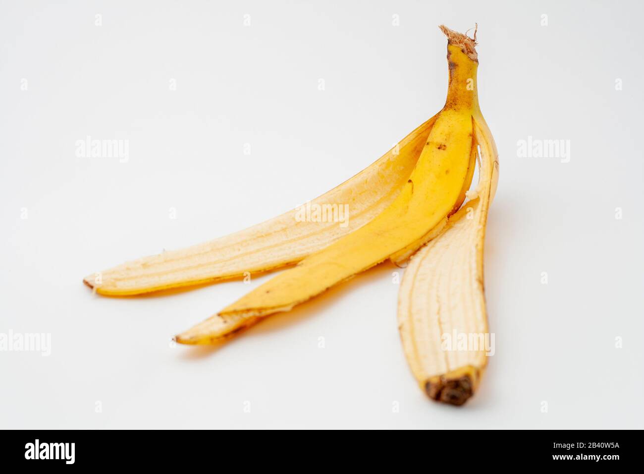 Banana peel on white background Stock Photo - Alamy