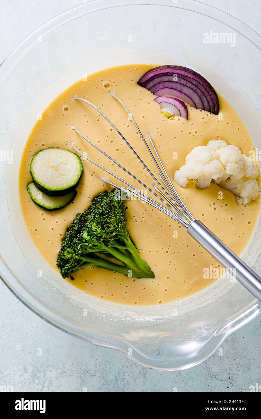 ready batter in a glass bowl for frying vegetables in oil Stock Photo ...