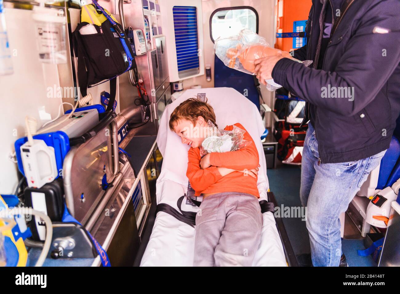 Valencia, Spain - February 29, 2020: Child lying on the stretcher of an ...